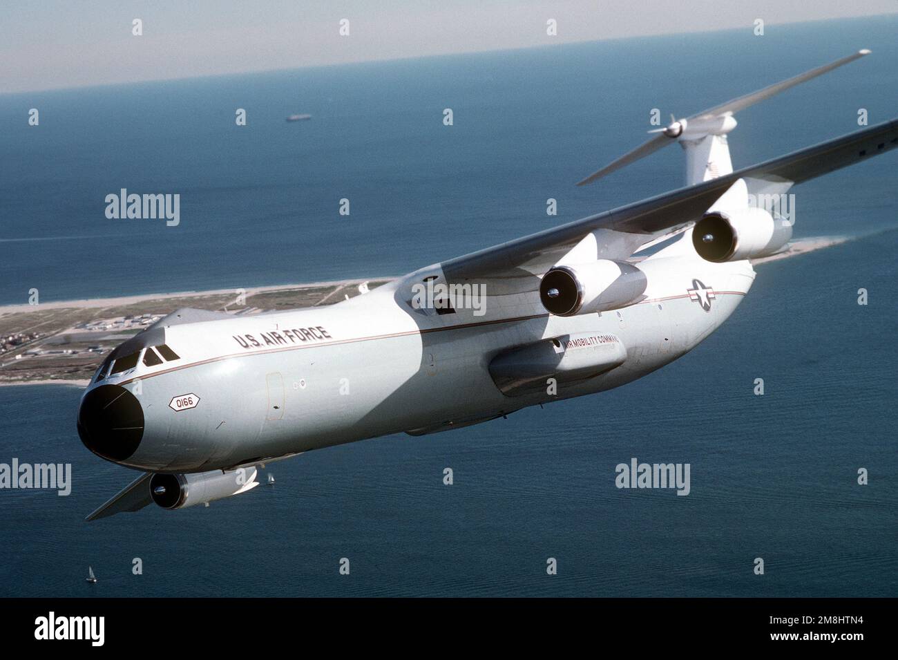 An air-to-air side view of a 438th Airlift Wing, C-141 Starlifter ...