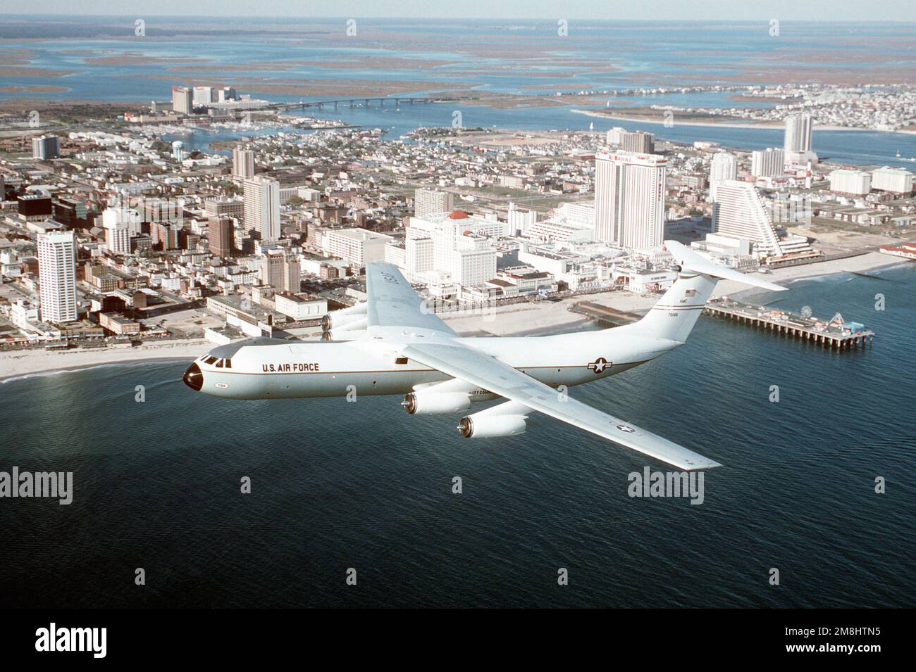 An air-to-air side view of a 438th Airlift Wing, C-141 Starlifter ...