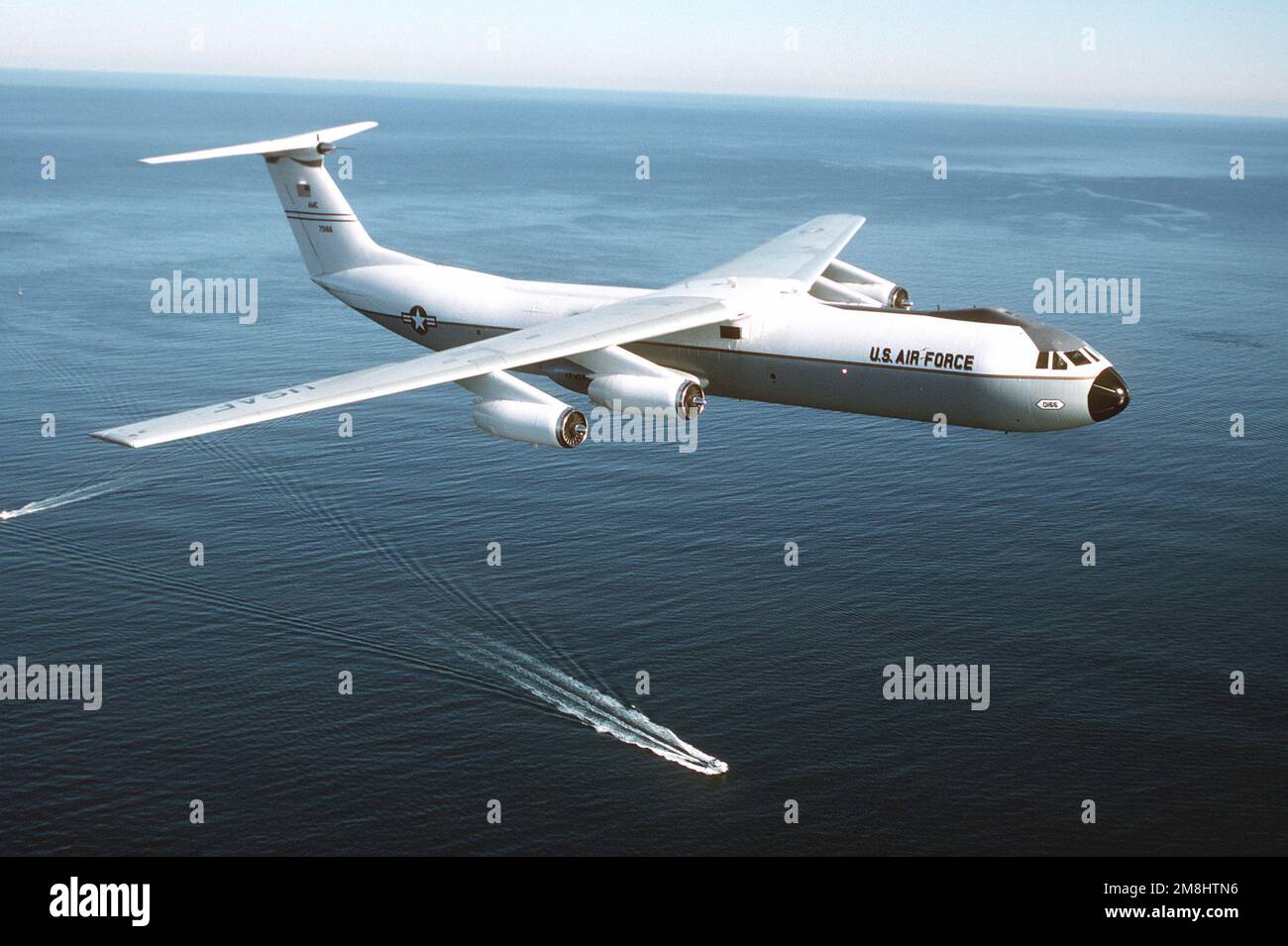 An air-to-air side view of a 438th Airlift Wing, C-141 Starlifter ...