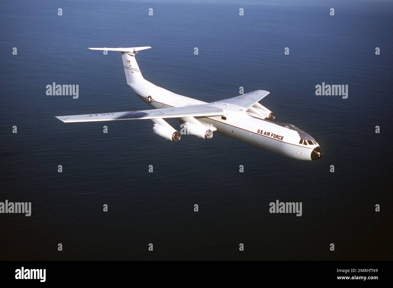 An air-to-air side view of a 438th Airlift Wing, C-141 Starlifter ...