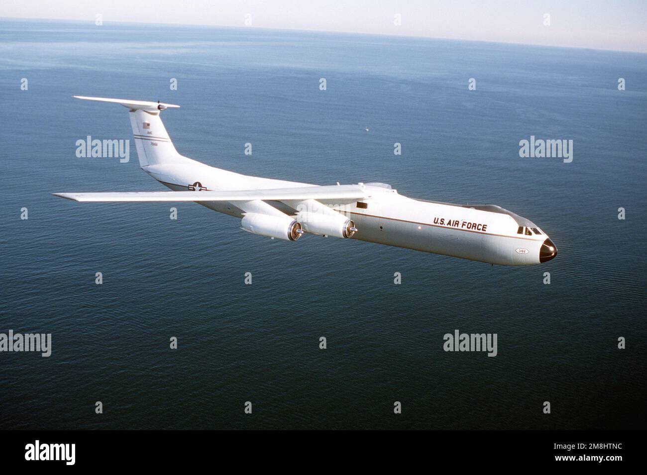 An air-to-air side view of a 438th Airlift Wing, C-141 Starlifter ...