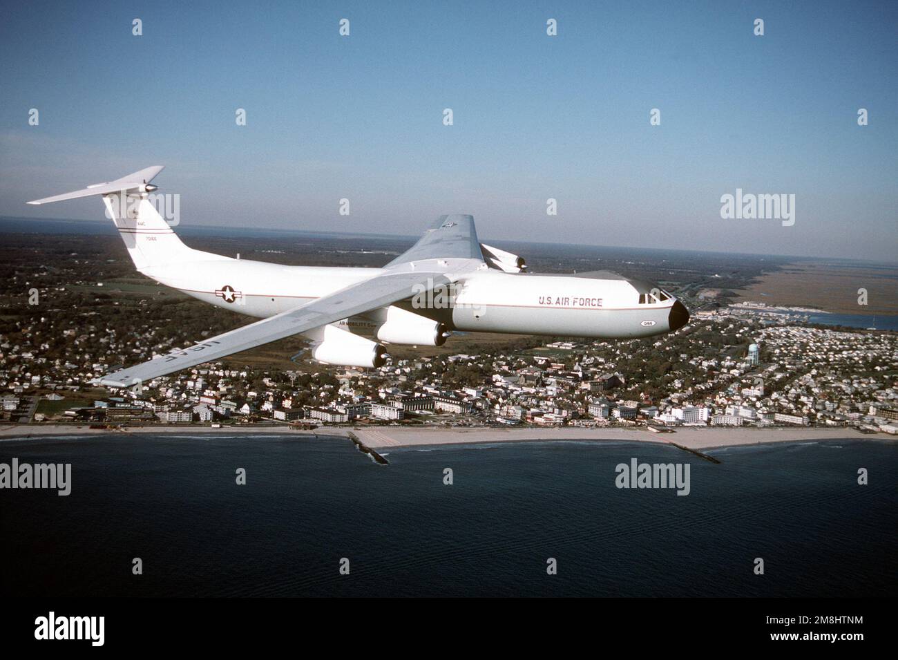An air-to-air side view of a 438th Airlift Wing, C-141 Starlifter ...