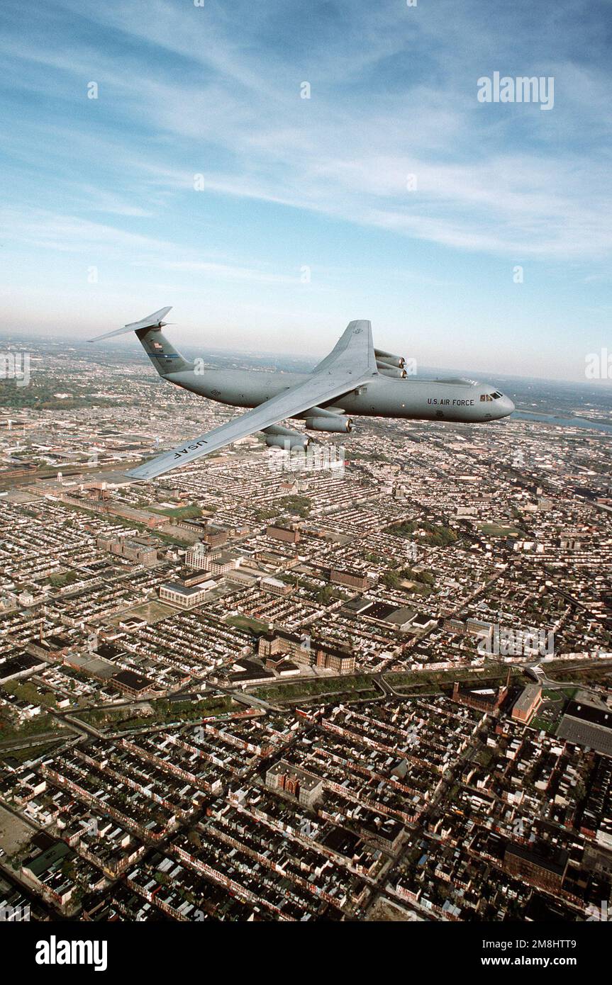 An air-to-air right side view of a 438th Airlift Wing, C-141 Starlifter ...