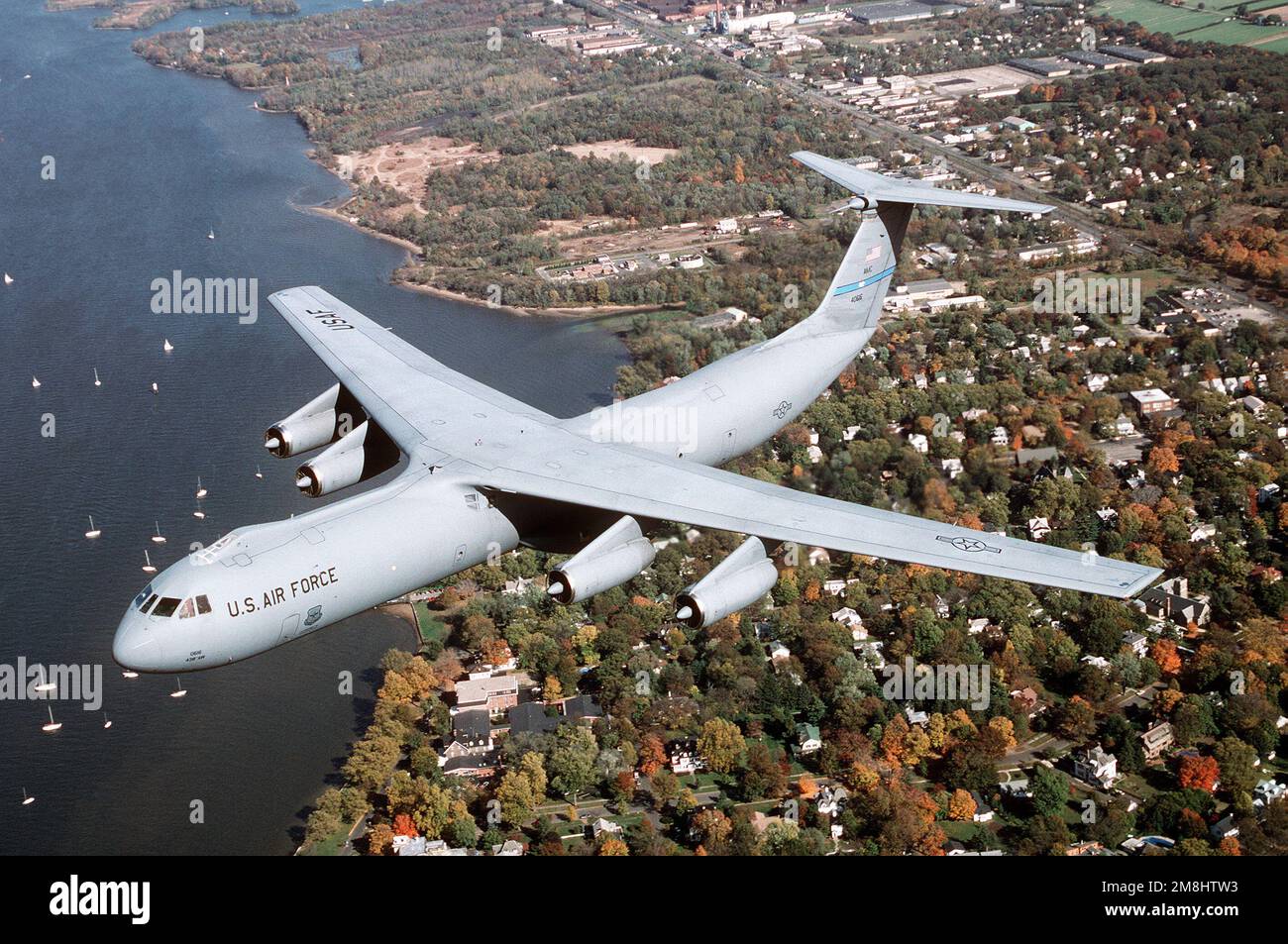 An air-to-air three quarter front-high view of a 438th Airlift Wing, C ...