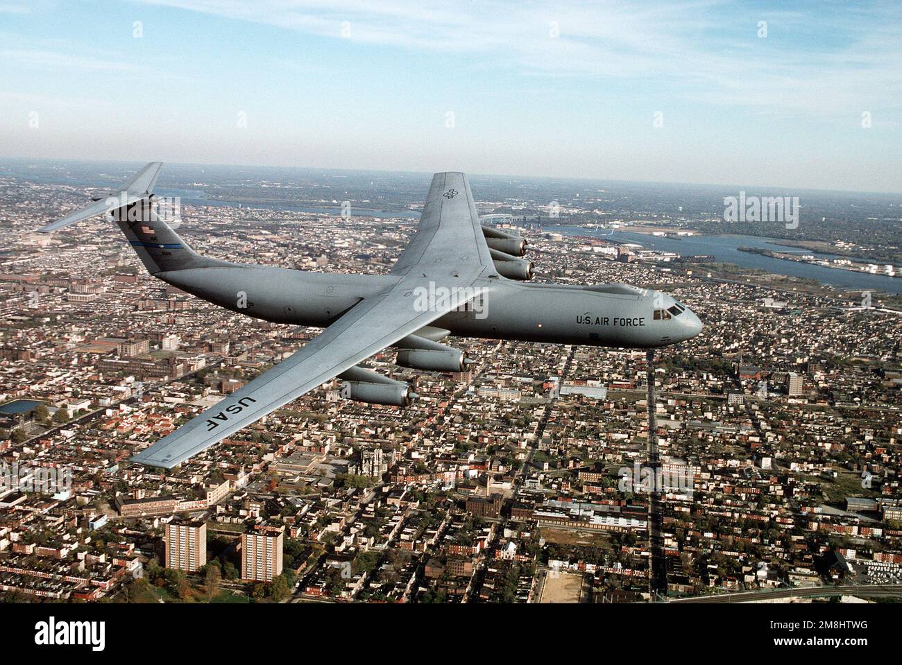 An air-to-air right side view of a 438th Airlift Wing, C-141 Starlifter ...