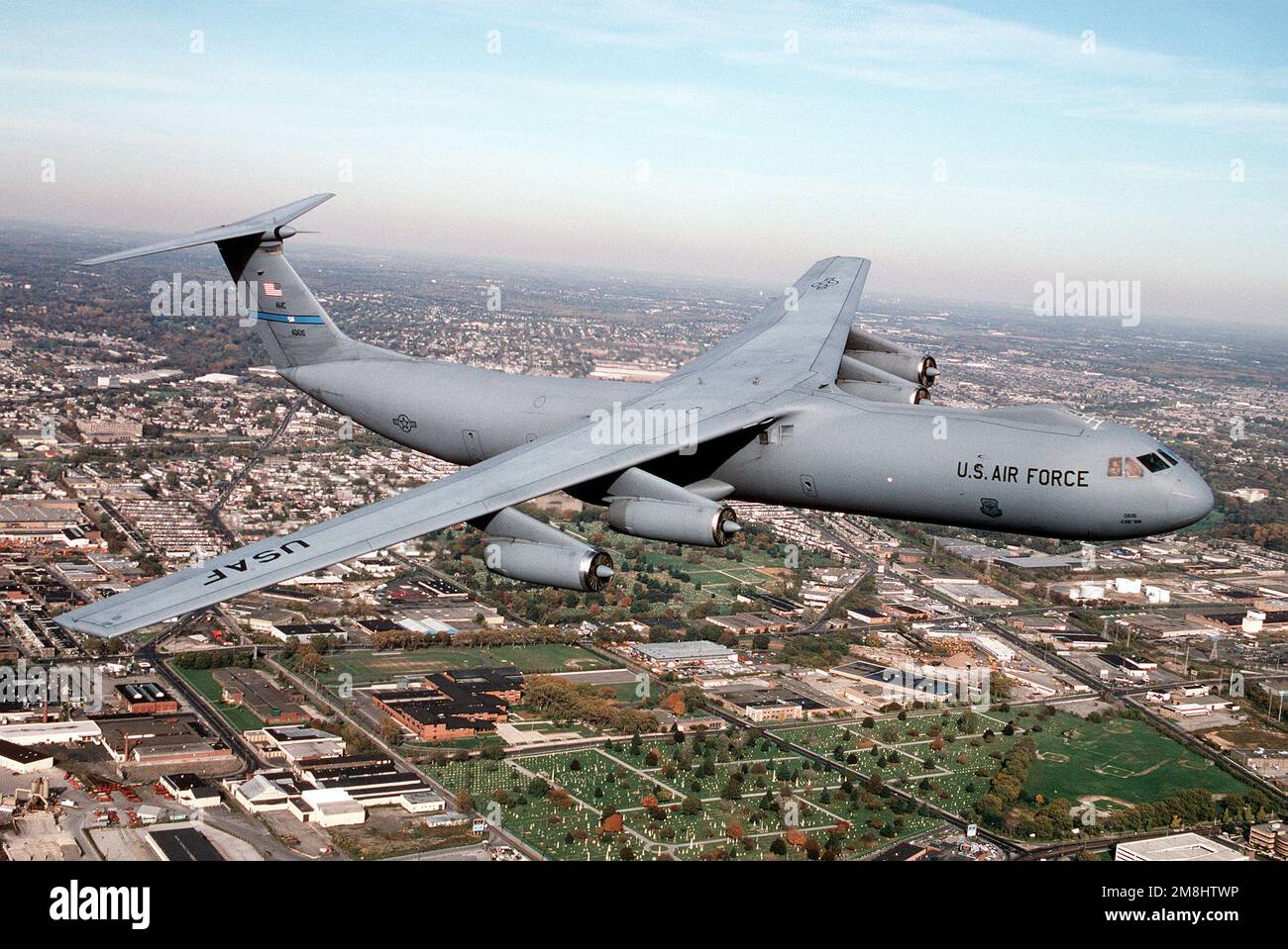 An air-to-air right side view of a 438th Airlift Wing, C-141 Starlifter ...