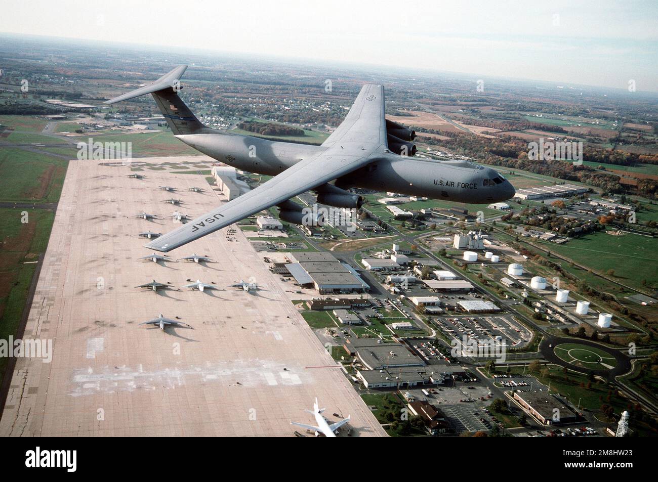 An air-to-air right side view of a 438th Airlift Wing, C-141 Starlifter ...