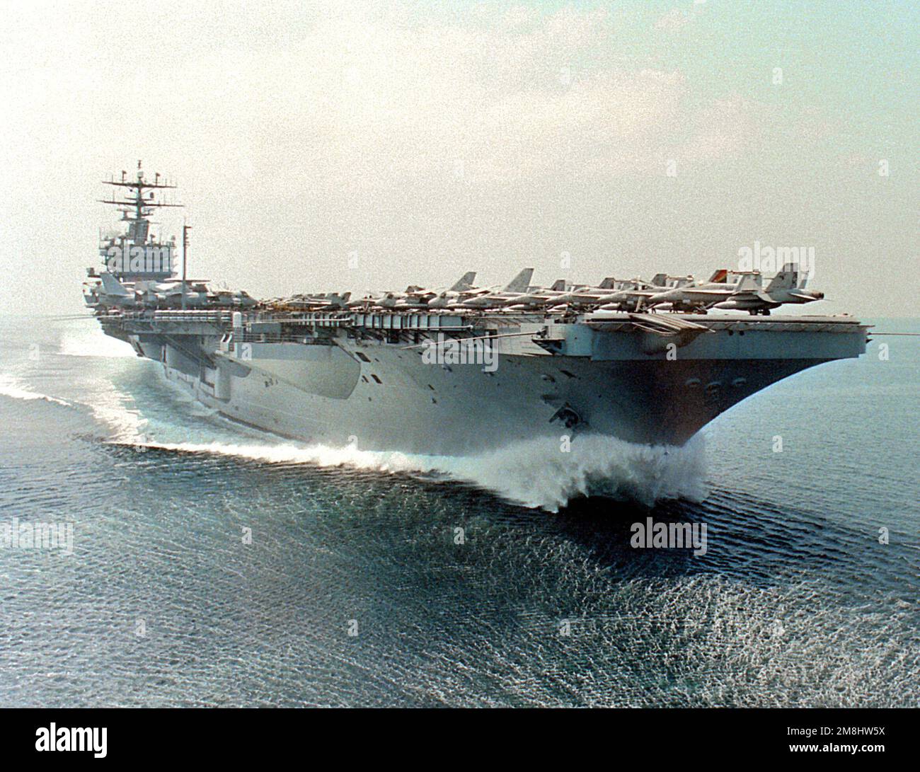 A starboard bow view of the nucelar-powered aircraft carrier USS CARL ...