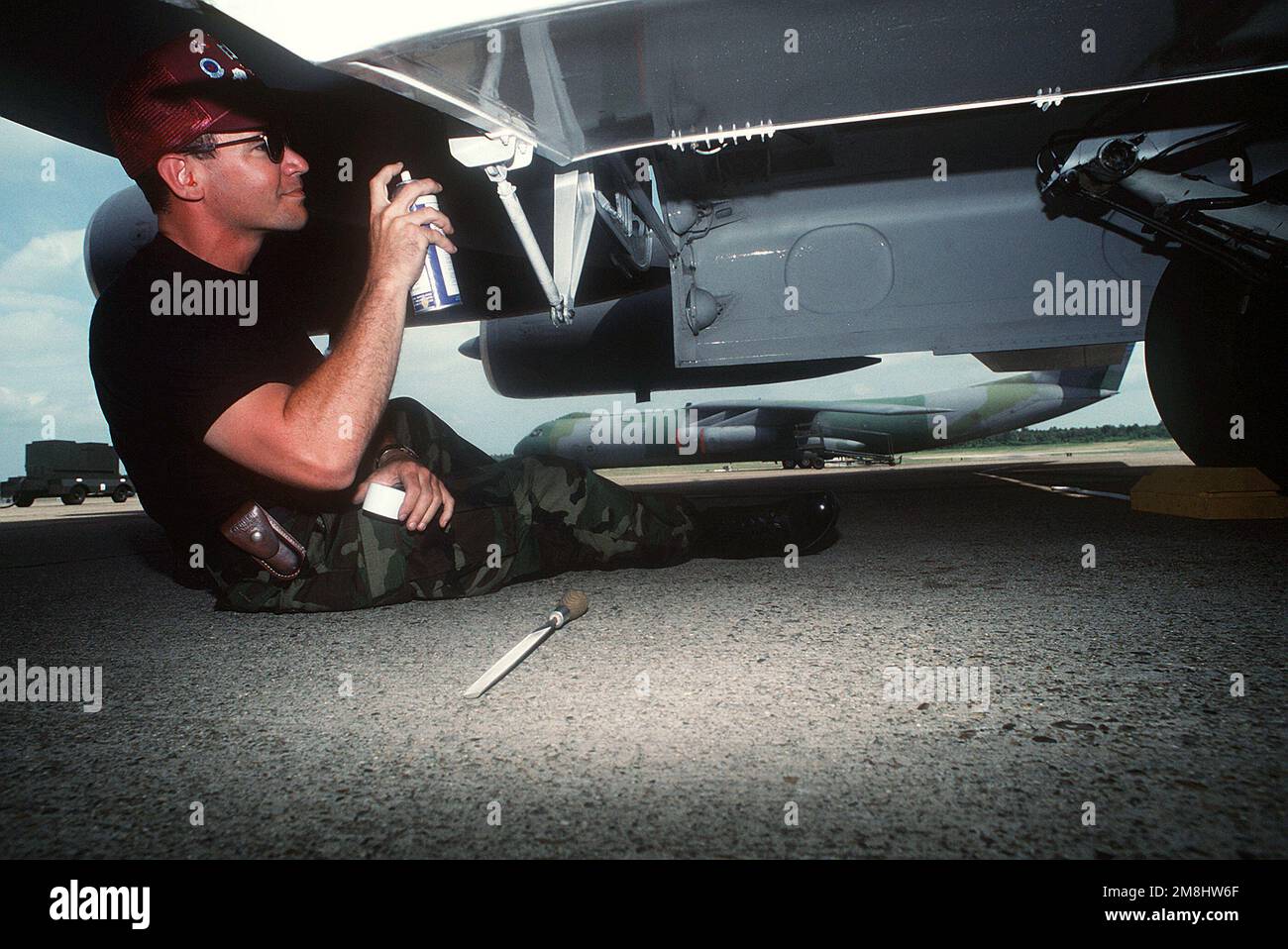 MASTER SGT. Wesley R. Brock, maintenance team chief pampers the ...