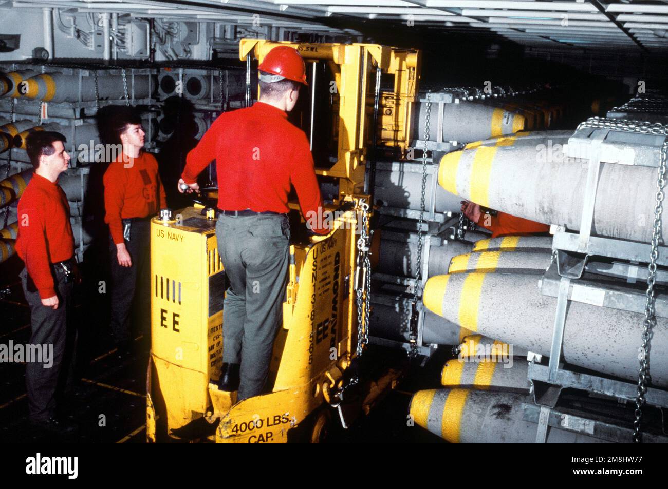 Ordnancemen place Mark 82 general purpose 500 Lb. bombs into storage in ...