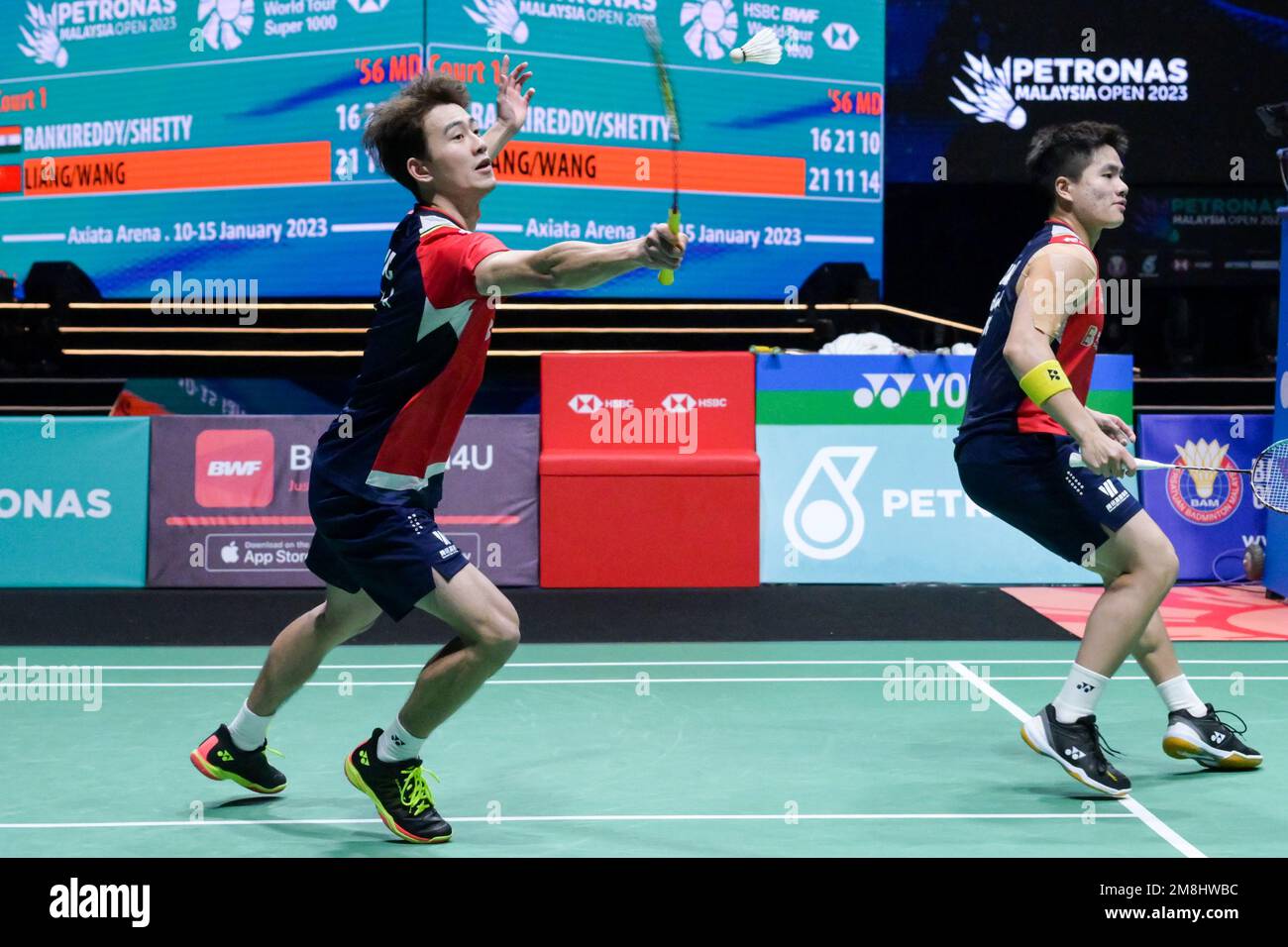 Kuala Lumpur, Malaysia. 14th Jan, 2023. China's Liang Weikeng/Wang Chang (L) compete during the ...