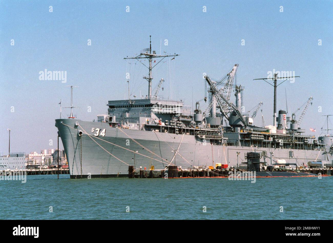 A port bow view of the submarine tender USS CANOPUS (AS-34) moored at ...