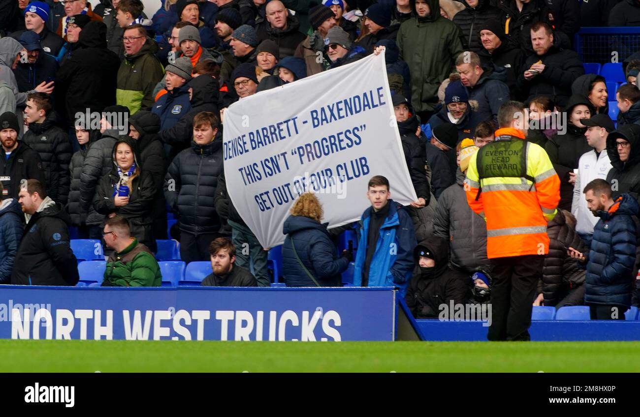 Everton fans hold up banners in protest against the clubs board ahead ...
