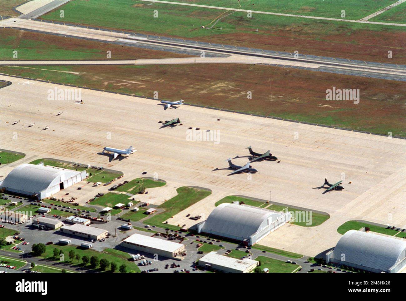 An aerial view of various aircraft parked on the flight line on the ...
