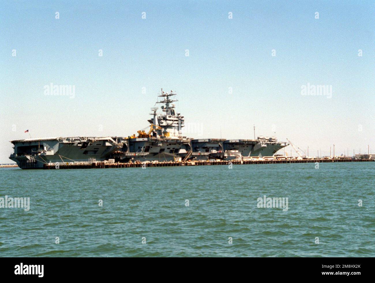 A starboard quarter view of the nuclear-powered aircraft carrier USS ...