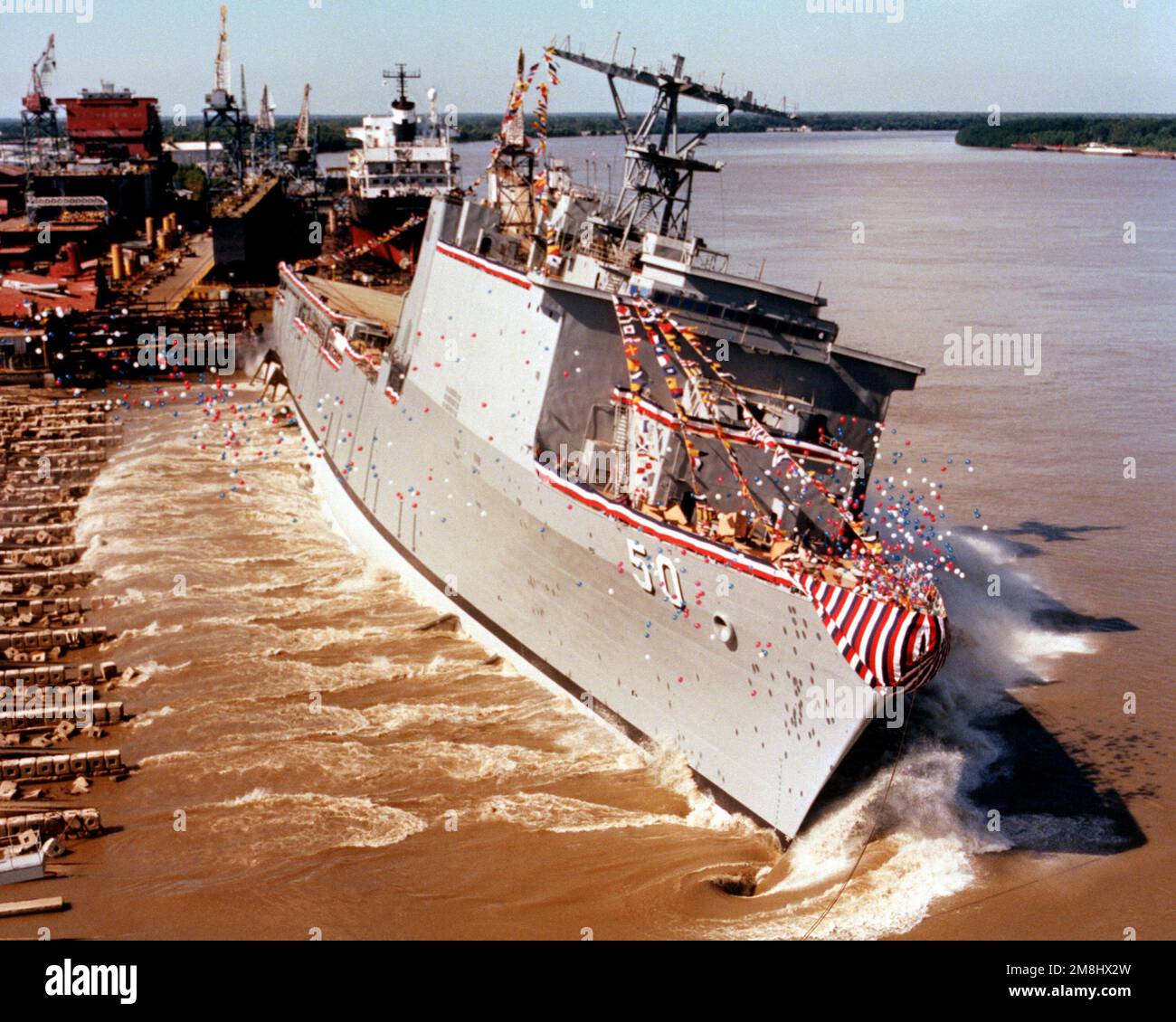 Balloons are released as the dock landing ship CARTER HALL (LSD-50) is ...