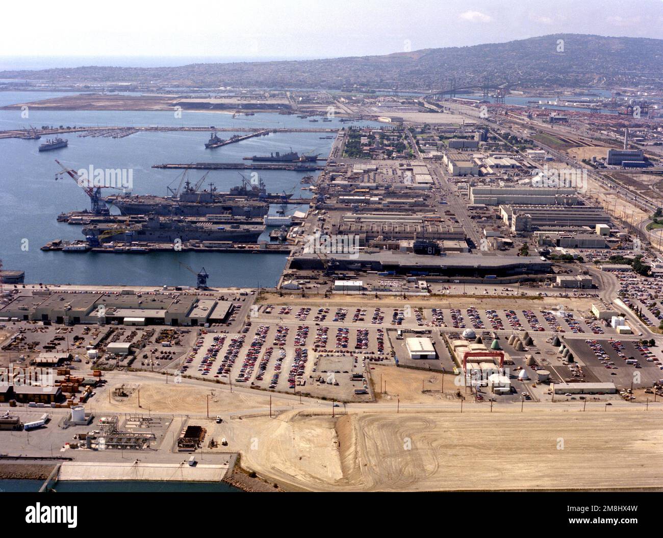 An aerial view of the amphibious assault ships USS ESSEX (LHD-2), front ...