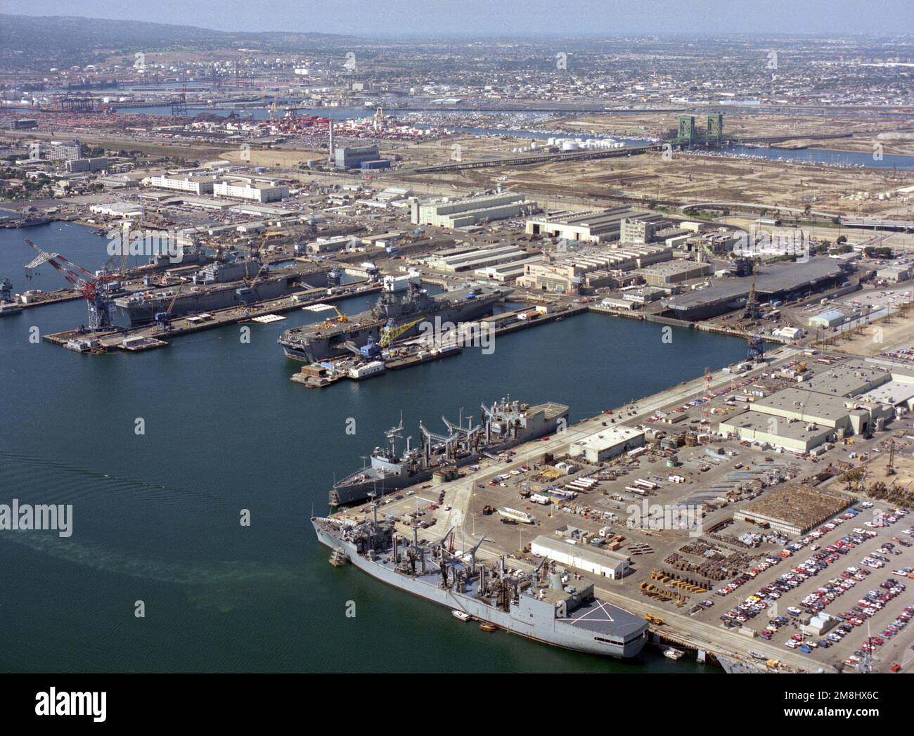 An aerial view of various ships moored at the shipyard. In the ...