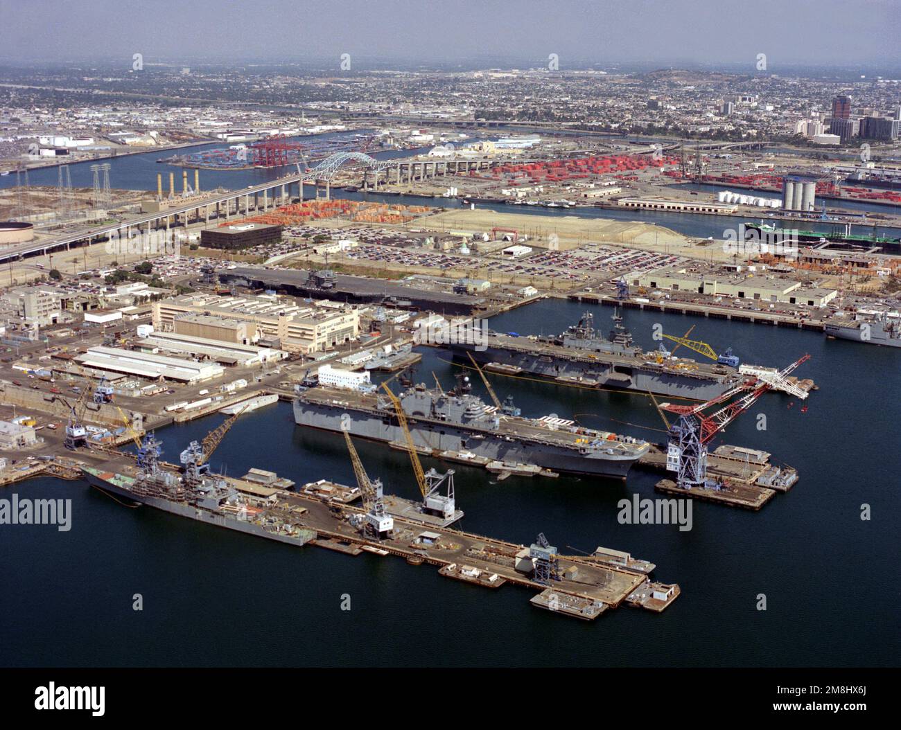 An aerial view of various ships moored at the shipyard. From front to ...