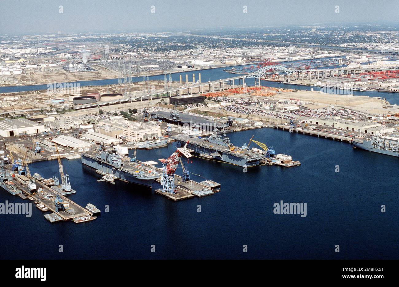 An aerial view of the amphibious assault ships USS TARAWA (LHA-1), left, and USS ESSEX (LHD-2 ...