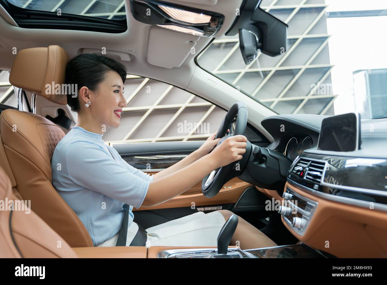 The young woman driving Stock Photo - Alamy