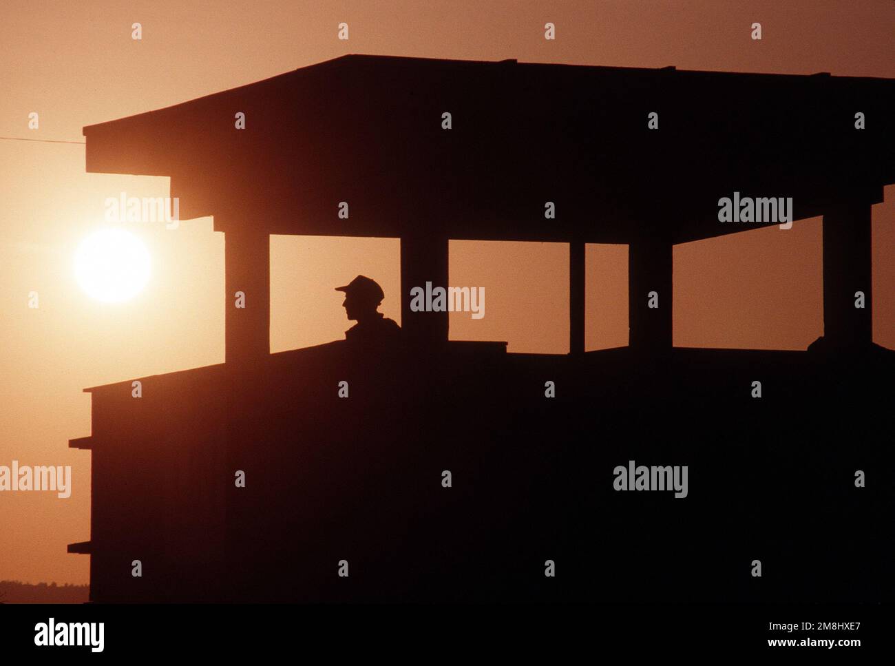 The sun rising over Camp Able Sentry guard tower number six. Subject ...