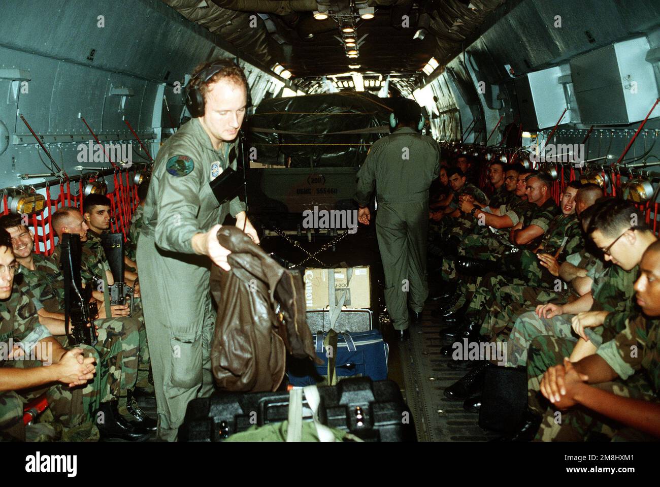 The 33 man team take their seats and STAFF SGT. Tom Donahoe, 1ST Combat ...