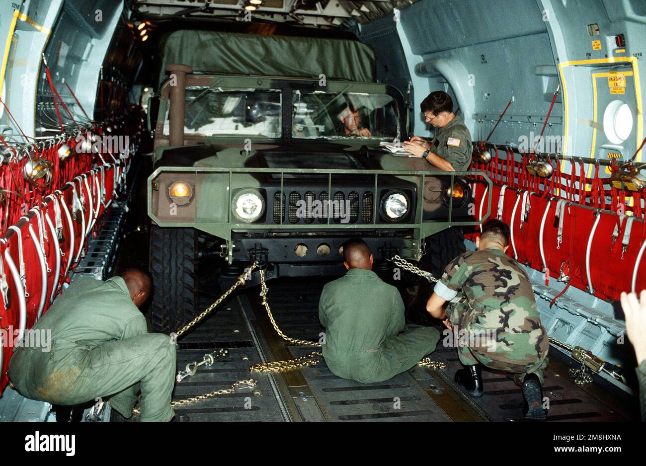 Marines from Cherry Point Marine Air Station, NC, chain down High ...