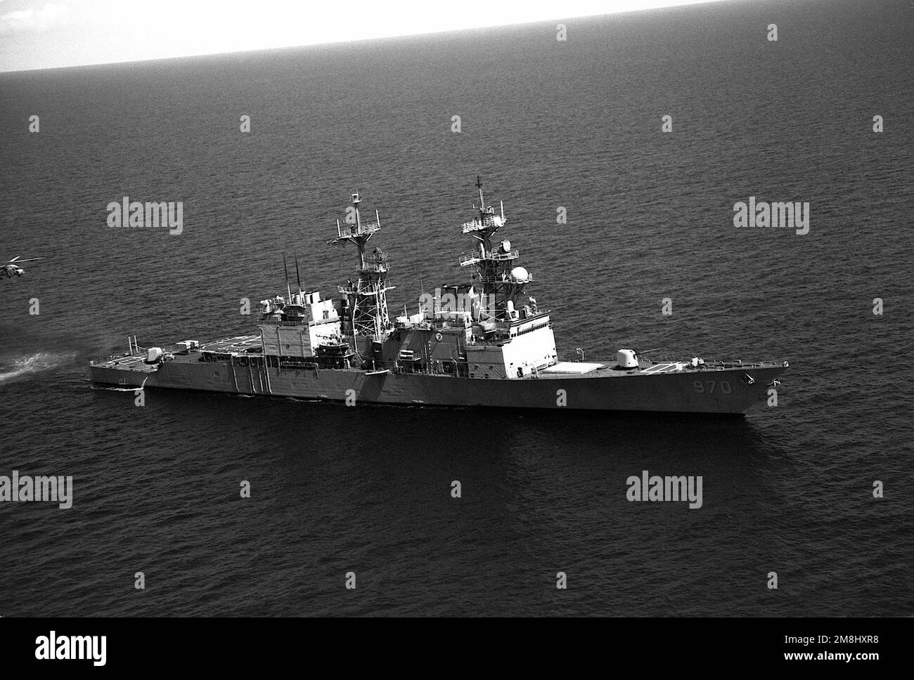 Aerial starboard bow view of the Spruance class destroyer USS CARON (DD ...