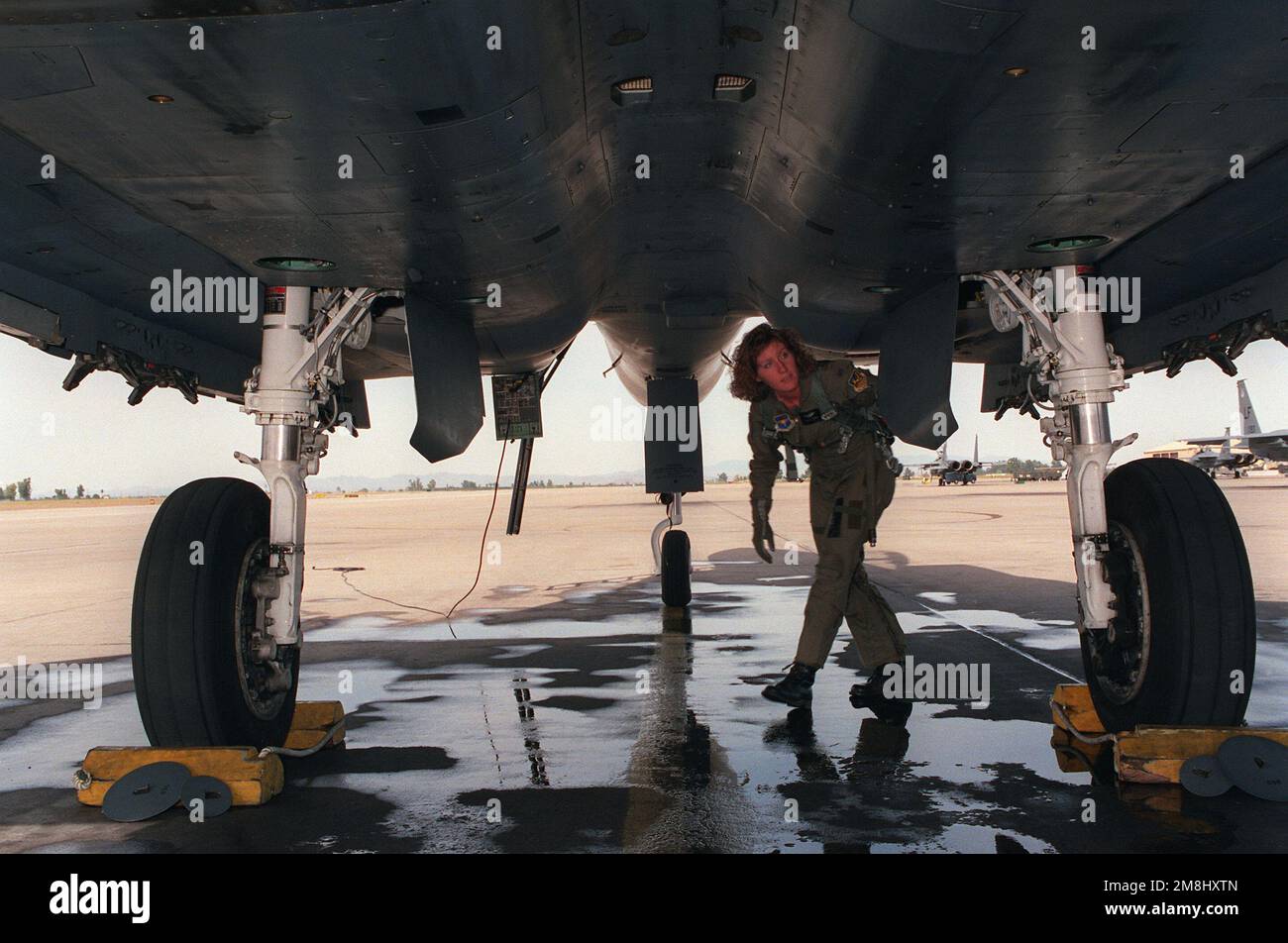 1ST LT. Jeannie Flynn inspects the right main landing gear door during ...