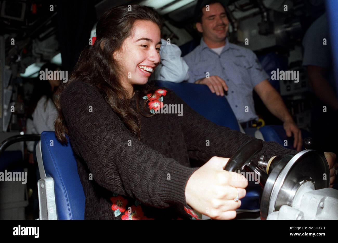 A student sits in a diving control station seat aboard the nuclear ...