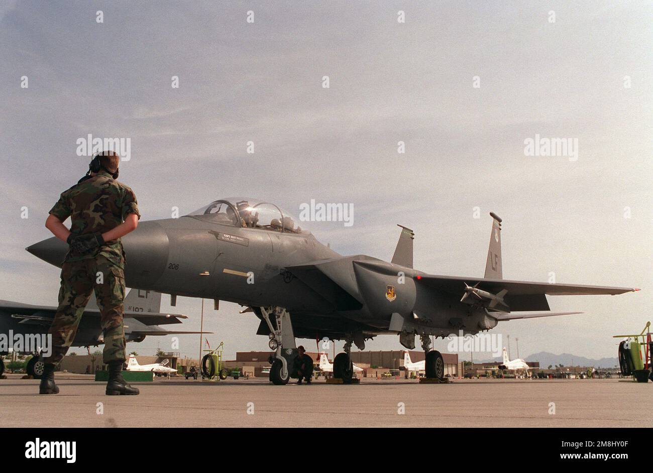 STAFF SGT. John L. Maliska stands by while 1ST LT. Jeannie Flynn ...