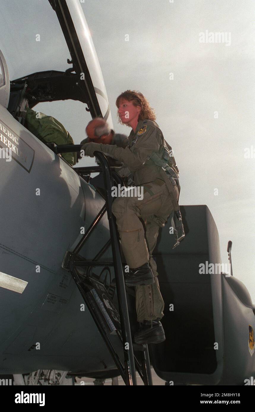 1ST LT. Jeannie Flynn, the first F-15E female pilot, climbs the ladder ...