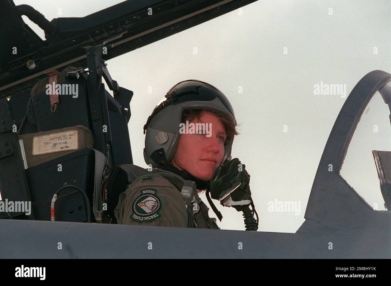1ST LT. Jeannie Flynn, the first F-15E female pilot, sits in the ...