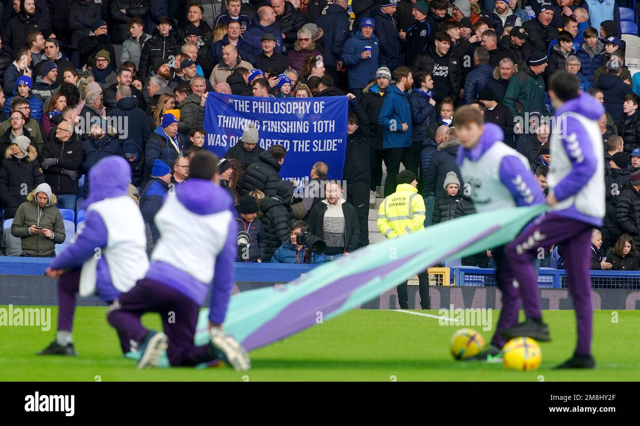 Everton fans hold up banners in protest against the clubs board ahead ...