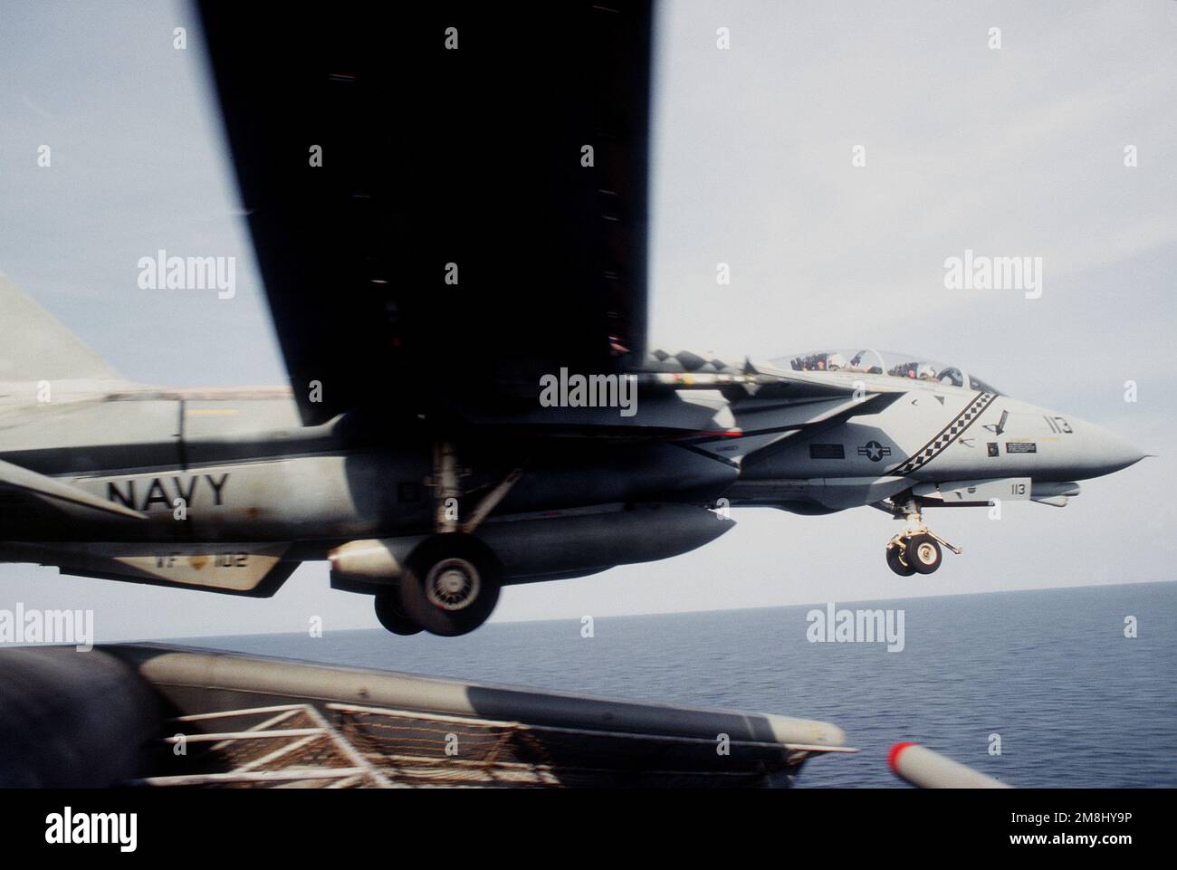 An F-14 Tomcat aircraft of Fighter Squadron 102 (VF-102) launches into ...