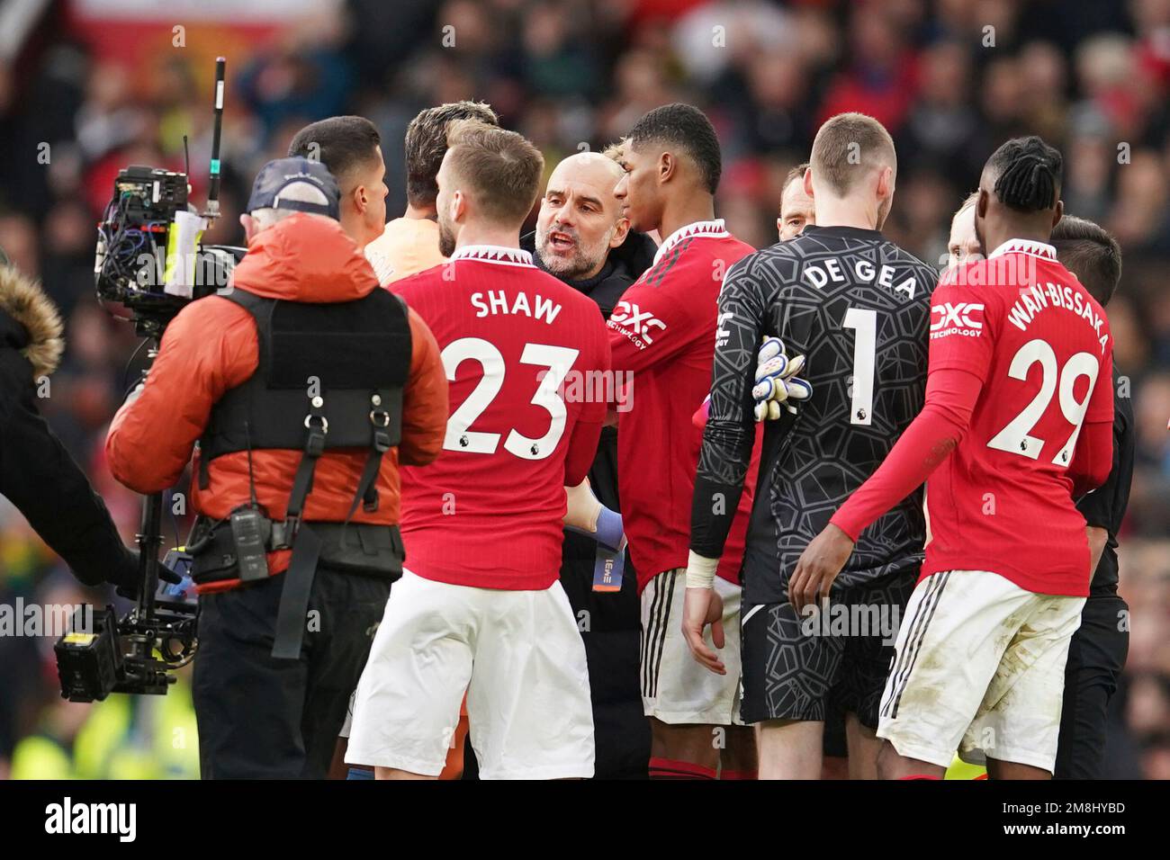 Manchester United's head coach Erik ten Hag prevents his players from ...