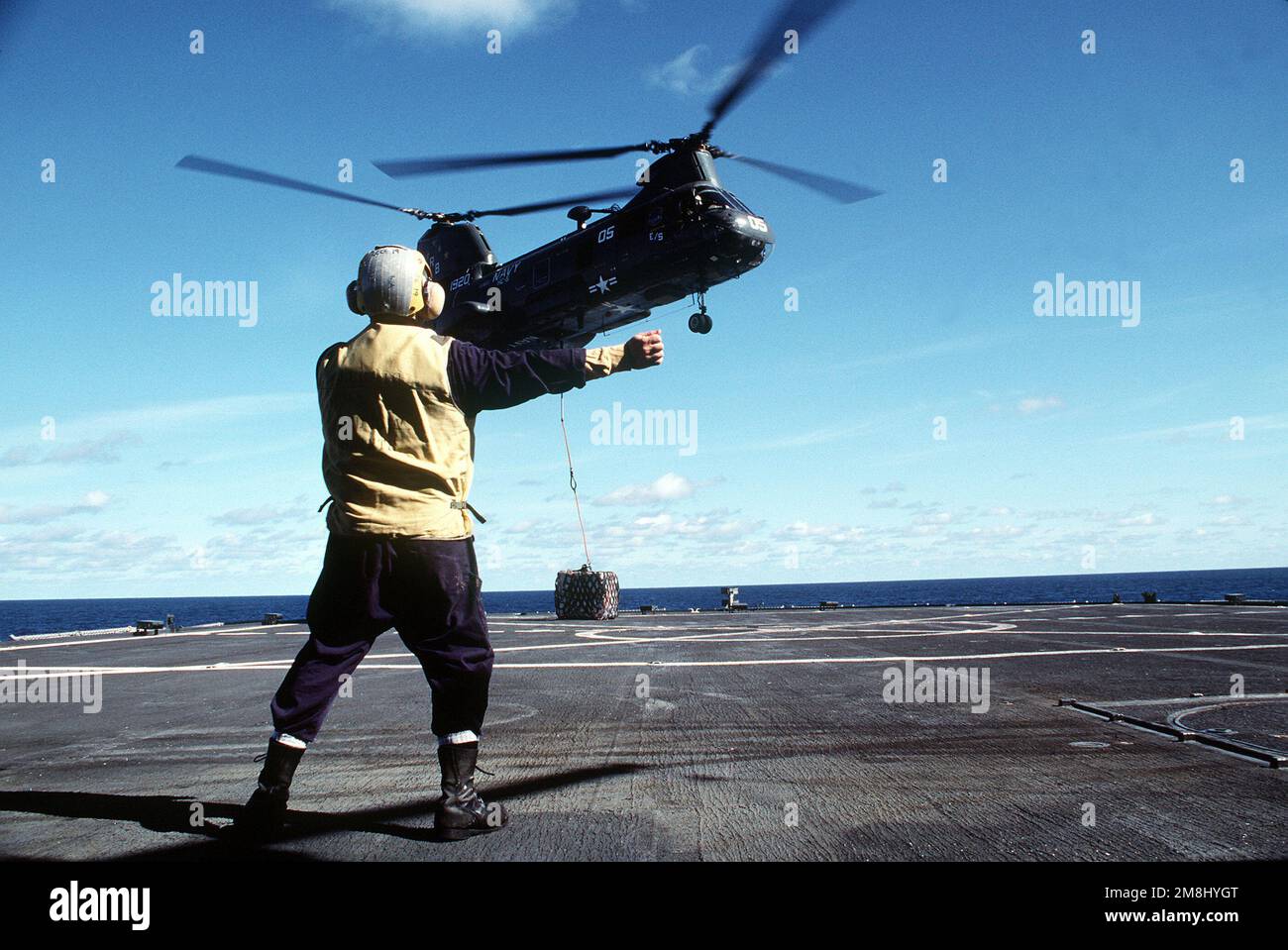 Landing Signal Enlistedman (LSE) Hull Technician Johnson signals that ...