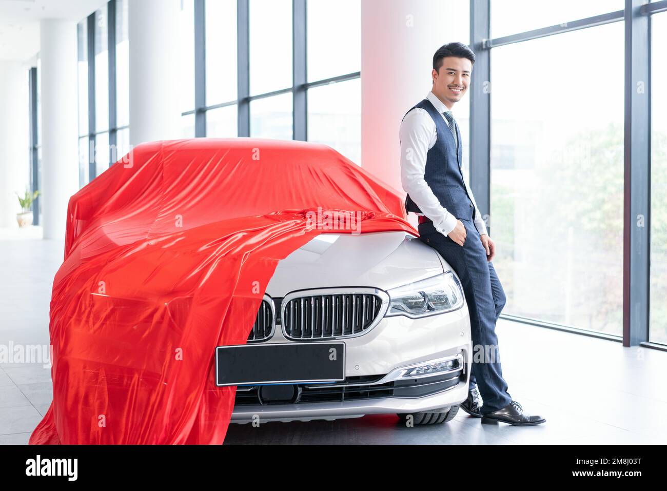 Young men to buy cars Stock Photo - Alamy