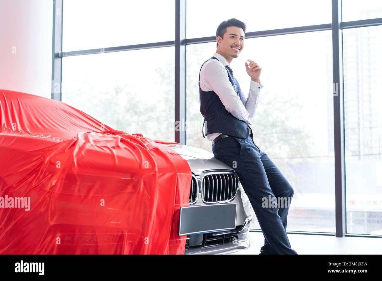 Young men to buy cars Stock Photo - Alamy