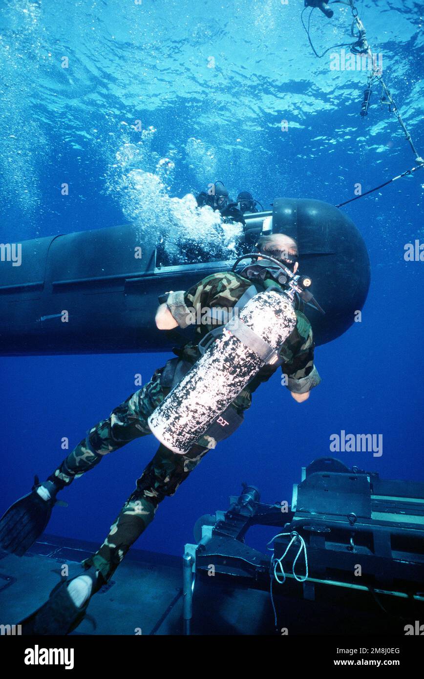 The drydock shelter (DDS) deck captain passes wet notes to the Mark 8 ...