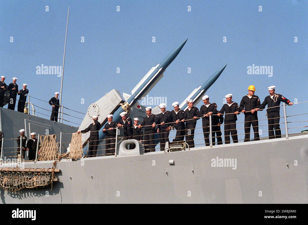 Crewmembers of the nuclear-powered guided missile cruiser USS LONG ...