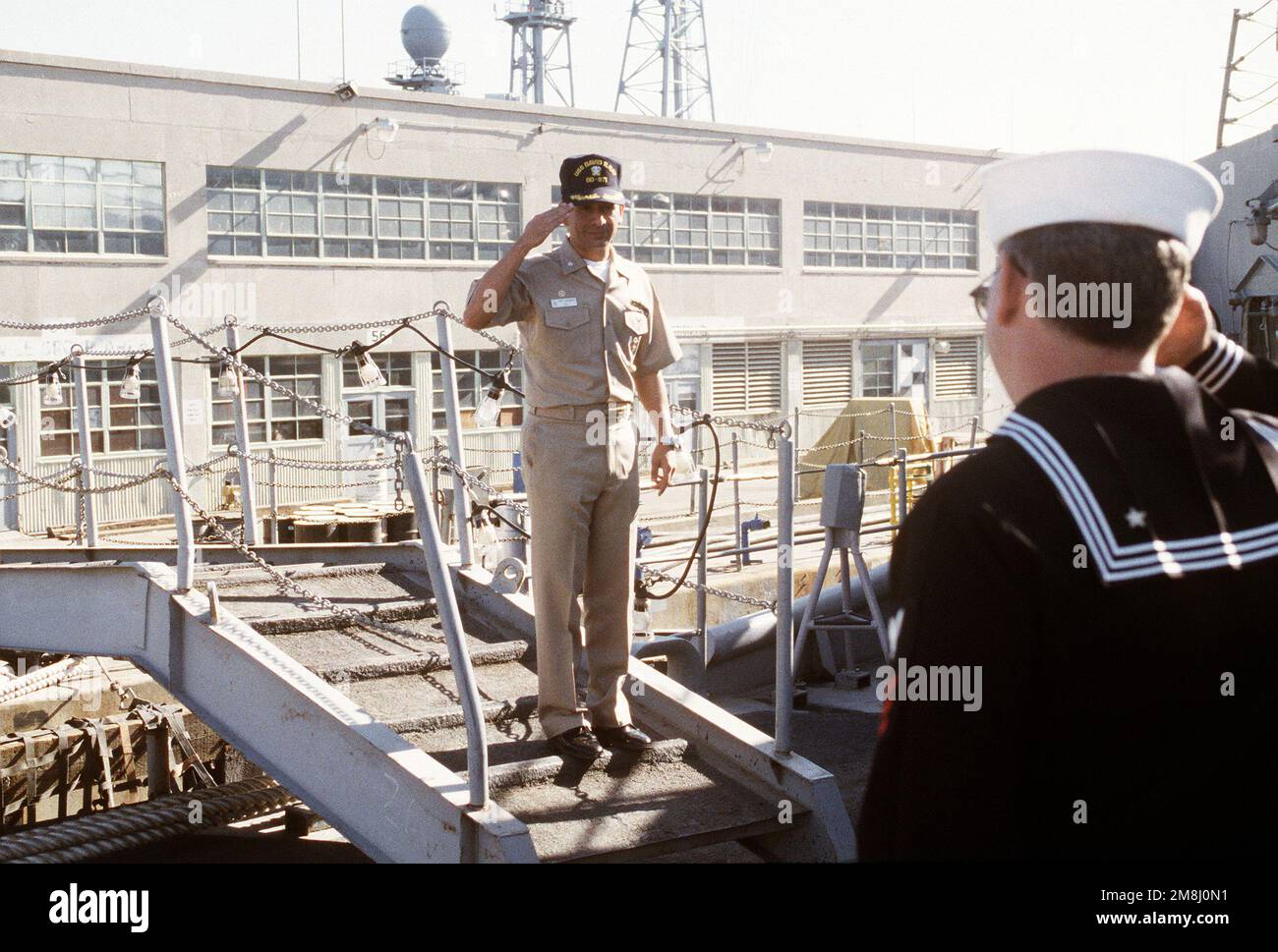 Commander Alberto E. Vasquez, Jr., commanding officer of the destroyer ...