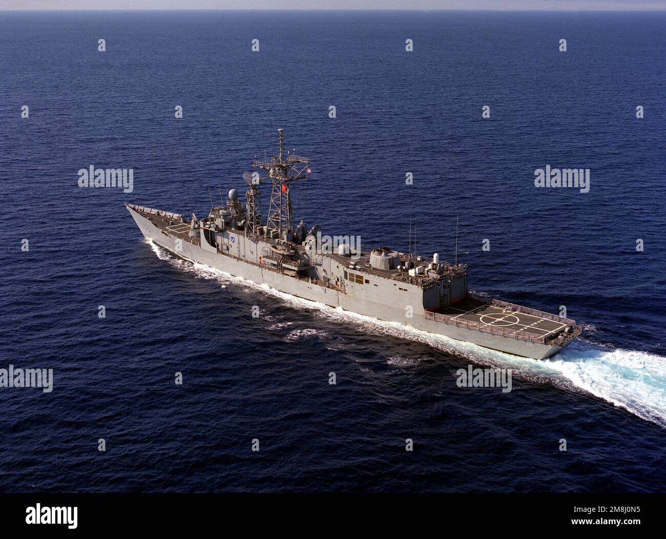 An port quarter view of the Perry class guided missile frigate USS ...