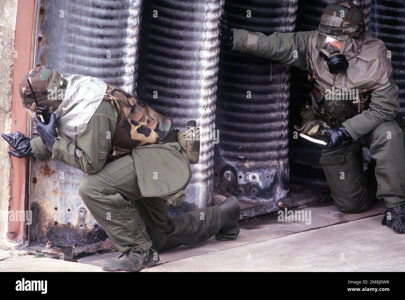 Two members from the 353rd Special Operations Group take cover in a ...