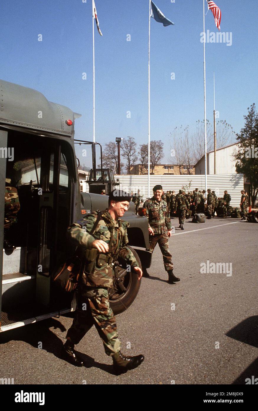 Troops exit the bus at the processing point for Foal Eagle '93. Subject ...