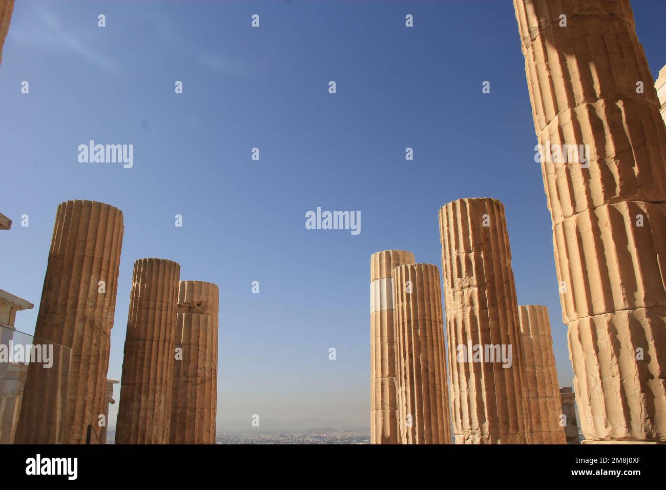 A beautiful shot of the ancient Doric order columns of the Acropolis of ...