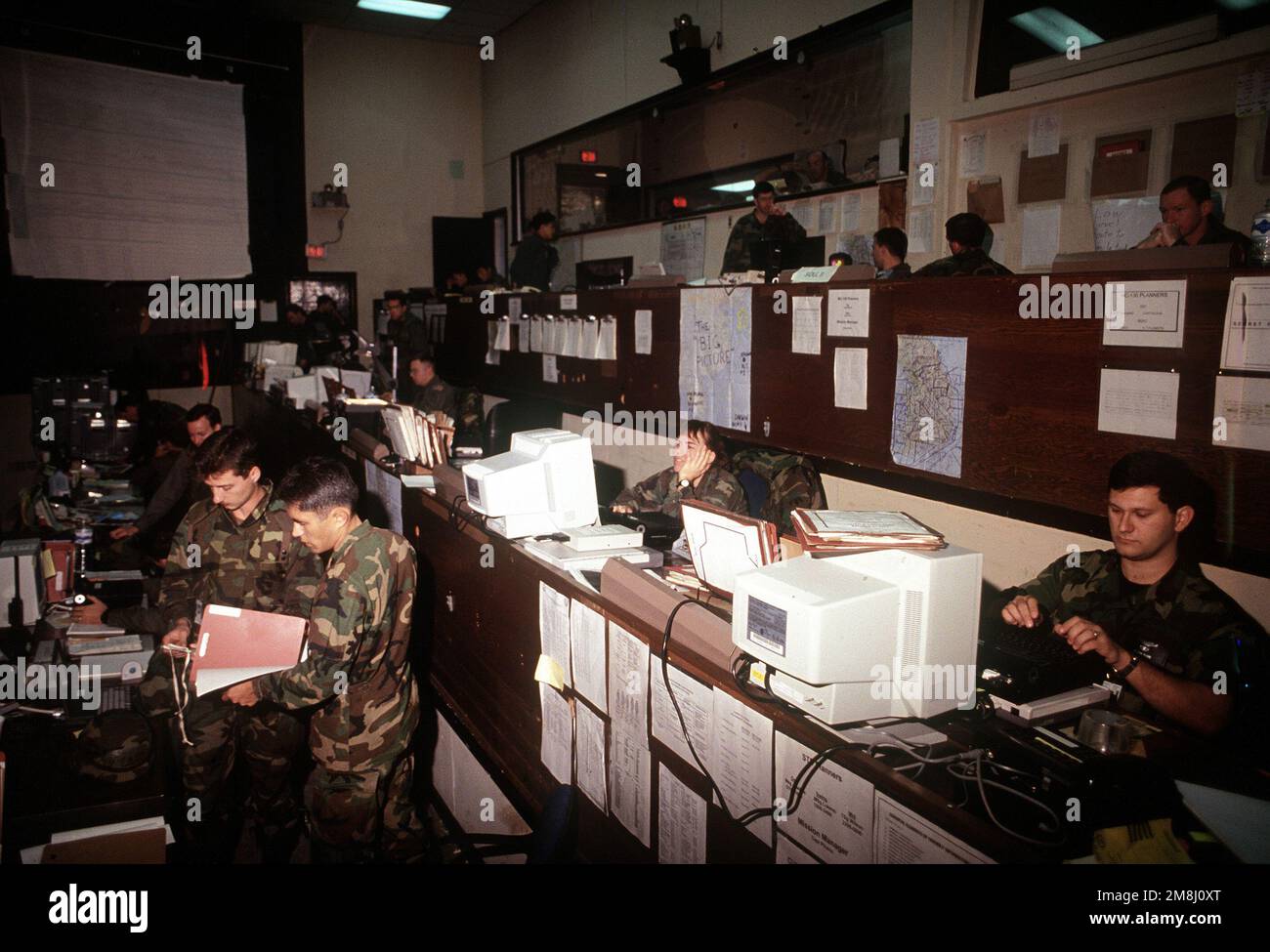 Personnel work from four tiers of computer and communication stations ...