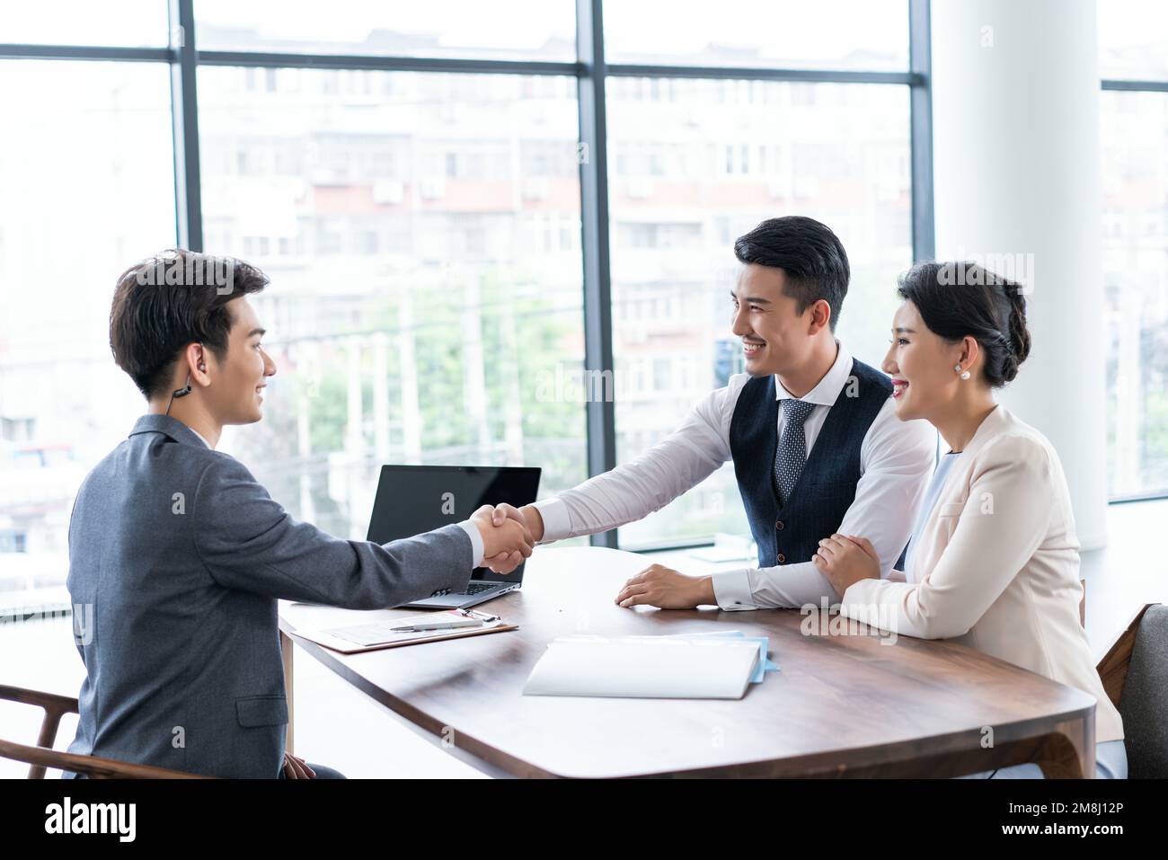 Professional couple suits hi-res stock photography and images - Alamy