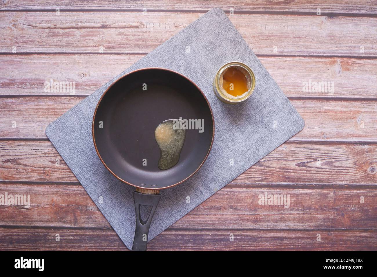 homemade ghee in cooking pan container on a table Stock Photo - Alamy